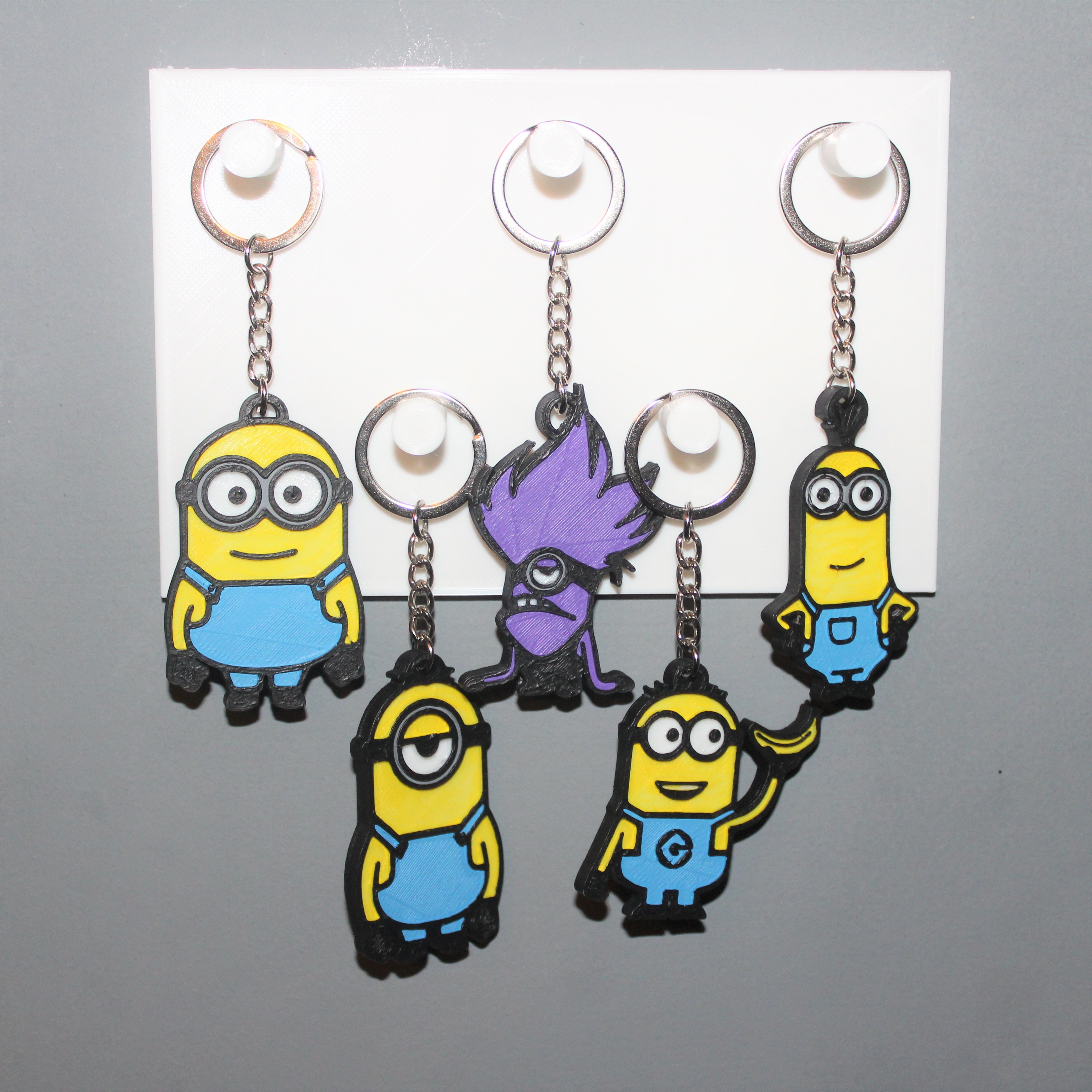 STL file 5 Keychain Minions 🗝️ ・3D print design to download・Cults
